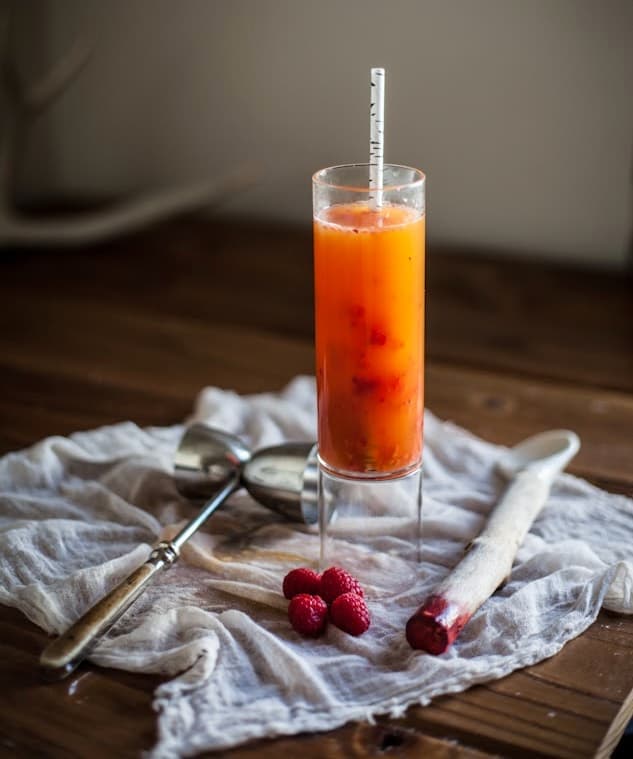 Jalapeño Infused Tequila with Mango Juice & Muddled Raspberries | Punchfork