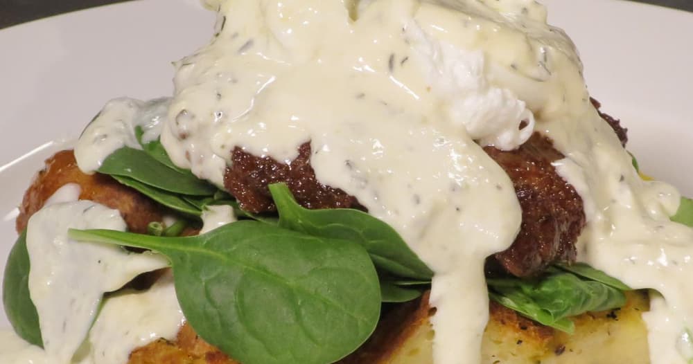 Savory Bread Pudding with Sausage, Spinach, Poached Eggs, and Parmesan ...