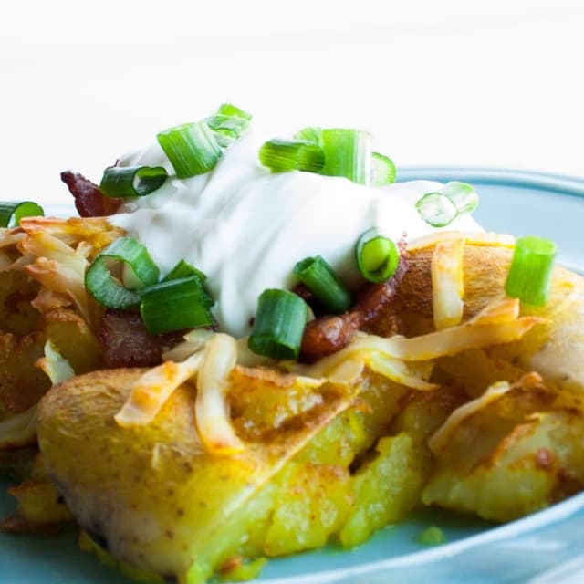 Yukon Gold Smashed Potatoes with Cheese | Punchfork