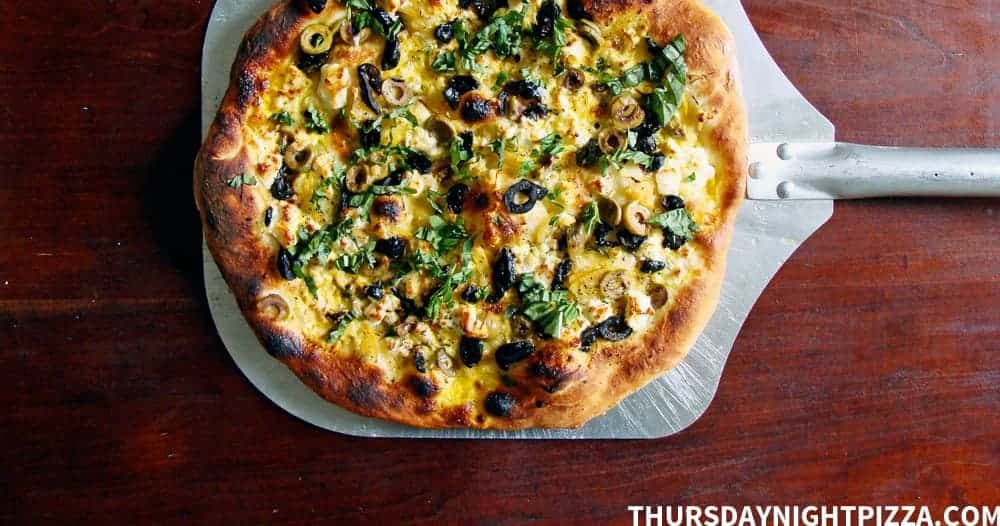 Moroccan-Inspired Pizza with Preserved Lemon, Olives, and Saffron Cream ...